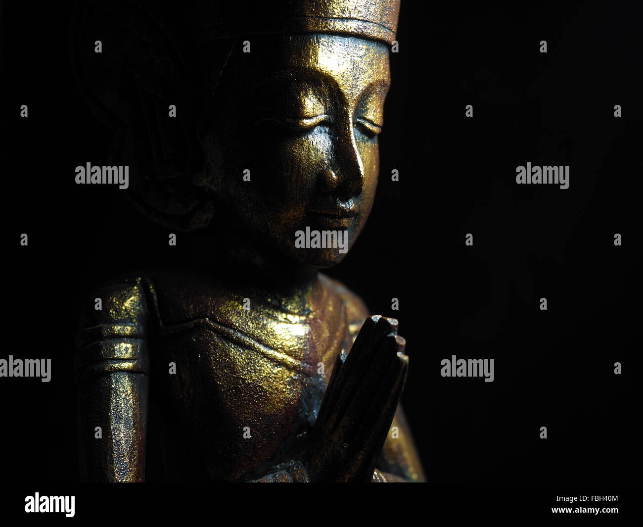 Golden Buddha low key Stock Photo - Alamy