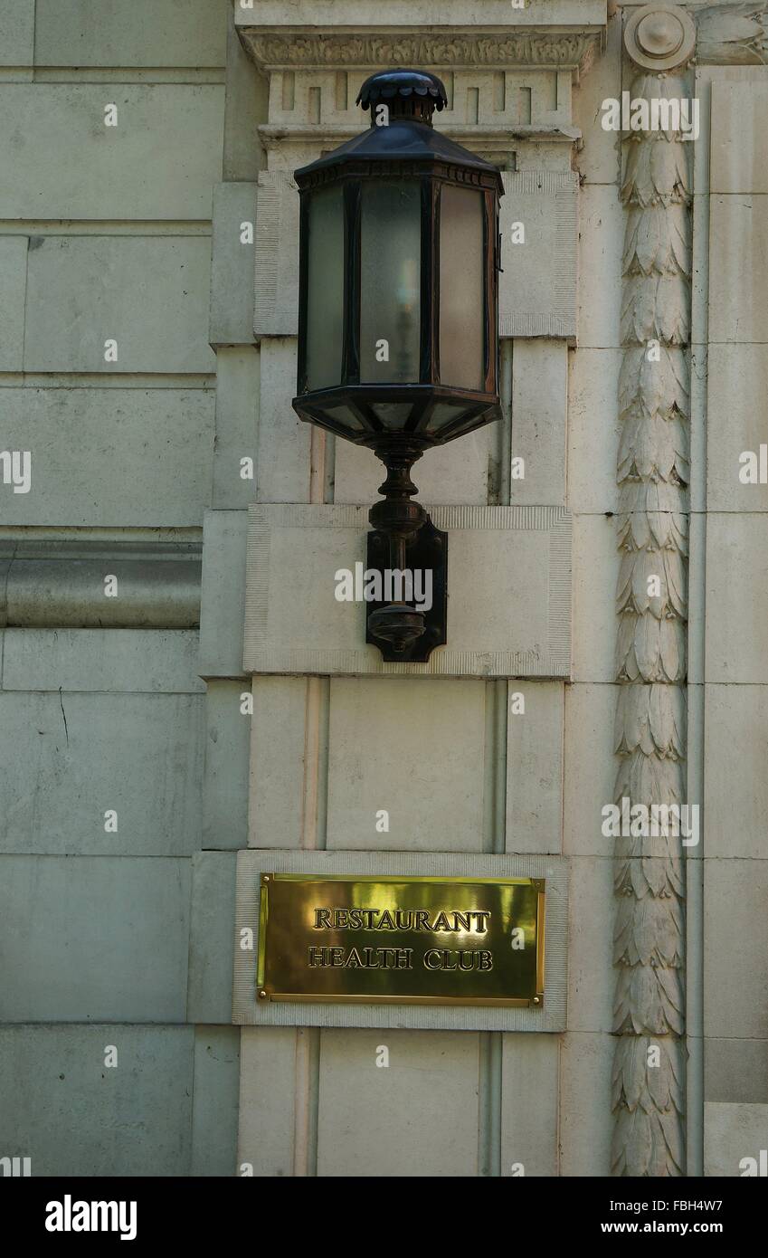 Restaurant & Health Club sign under a historical lamp in the city of ...