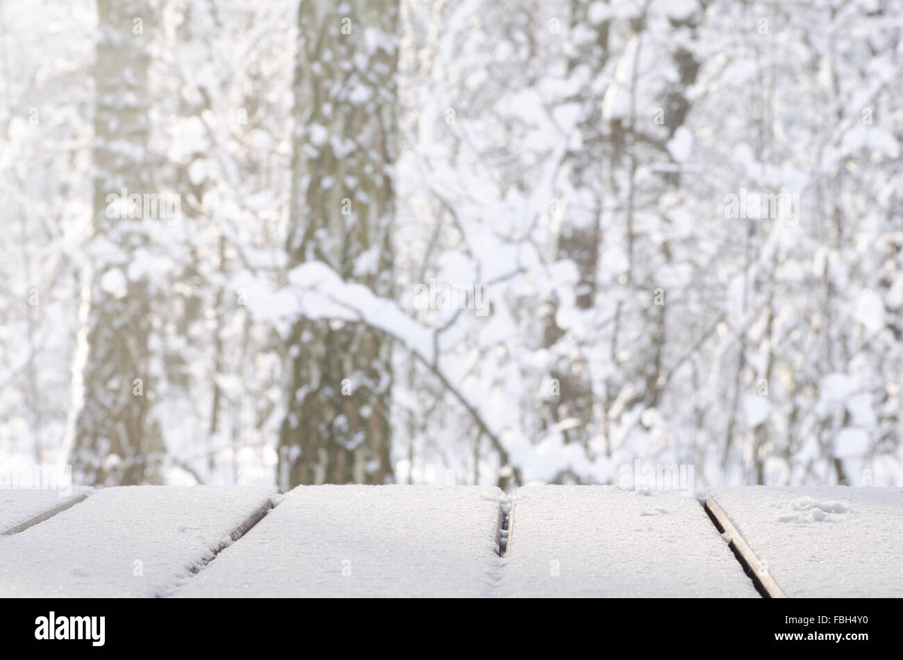 closeup to empty table covered with snow Stock Photo - Alamy