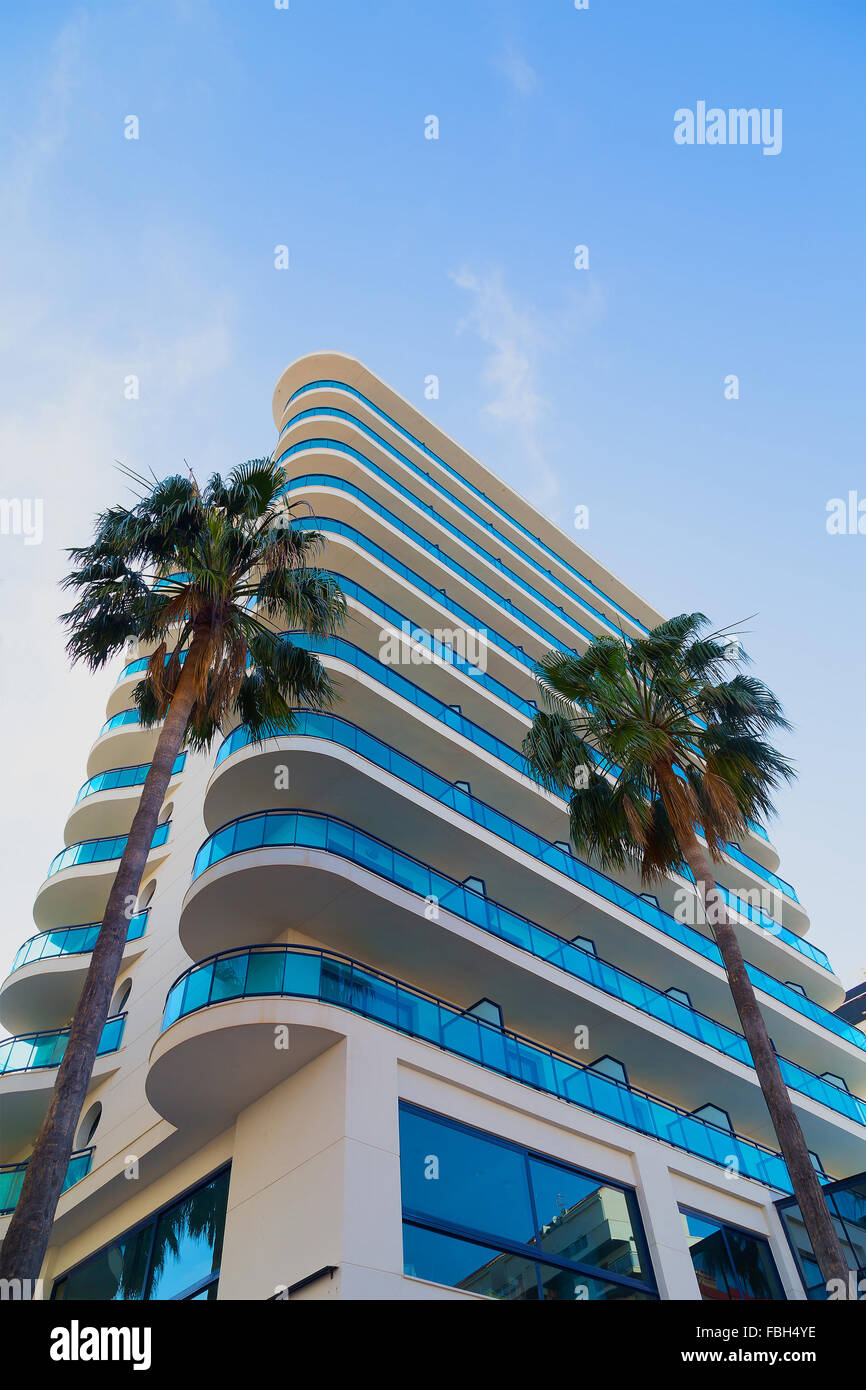 Building tower and palms of Mediterranean Stock Photo - Alamy