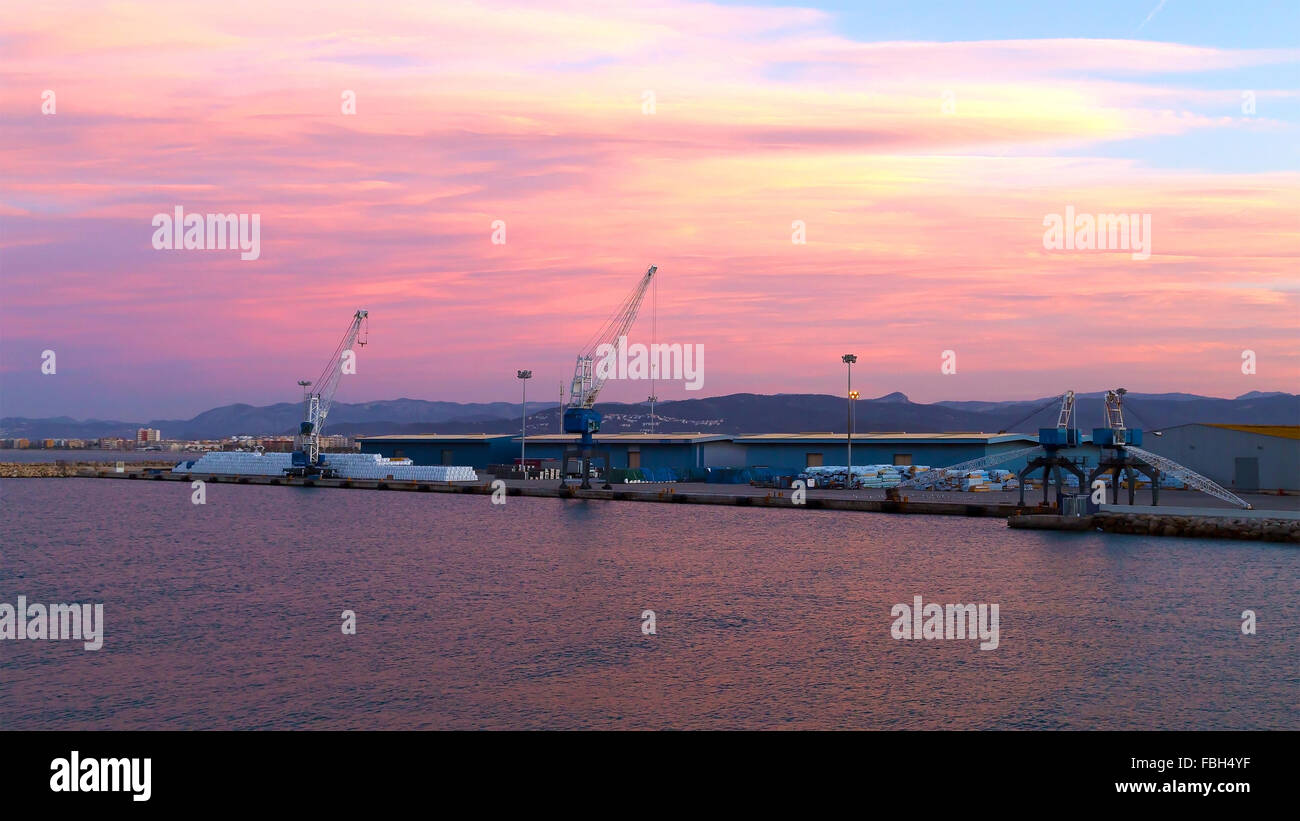 Sea port at sunset Stock Photo - Alamy