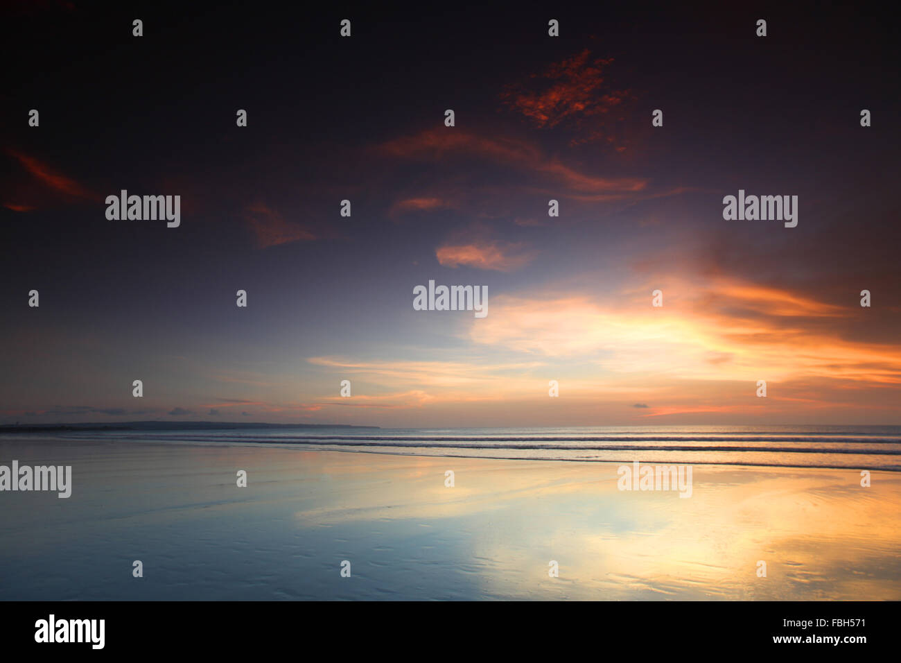 Radiant sea beach sunset on Bali Stock Photo - Alamy