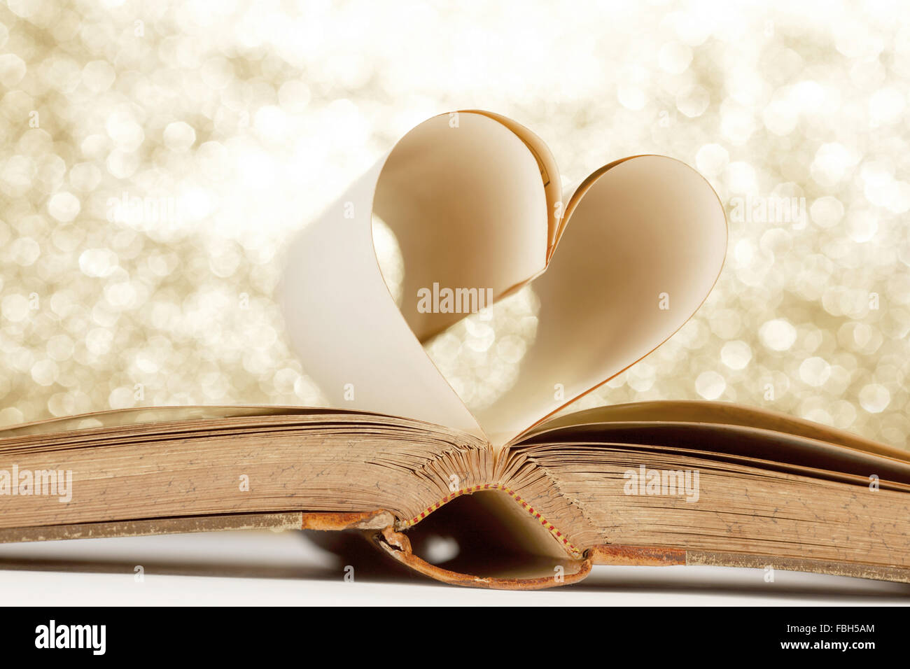 Heart shape made from book pages hi-res stock photography and images ...
