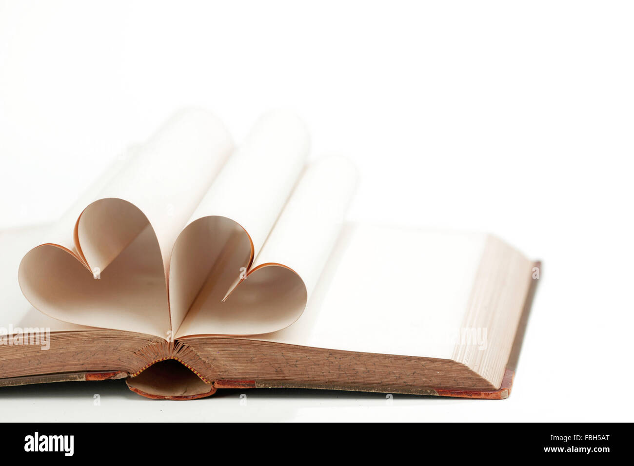 Heart shape made from book pages hi-res stock photography and images ...
