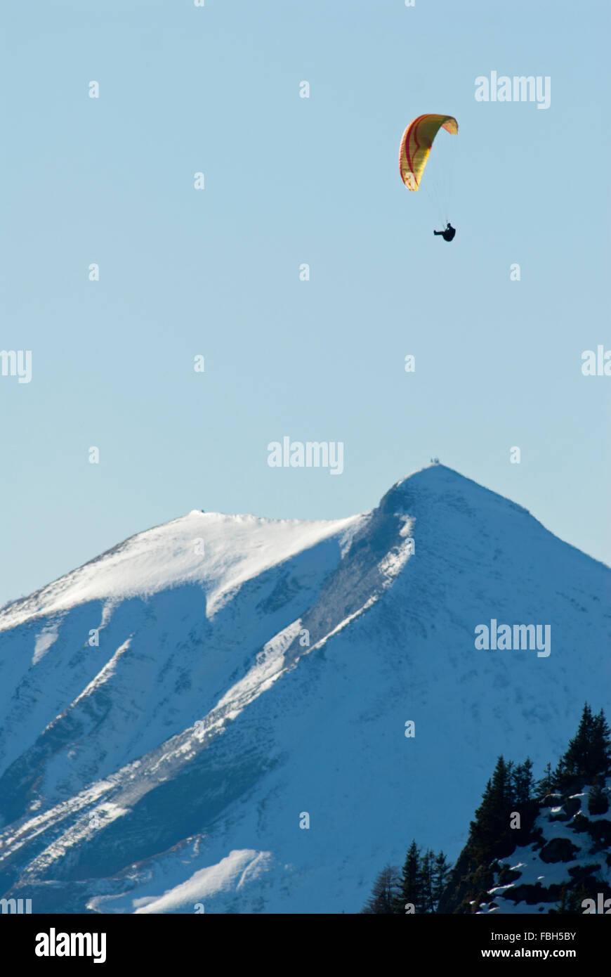 Paragliding pilot soaring high over Chamonix Valley Stock Photo - Alamy