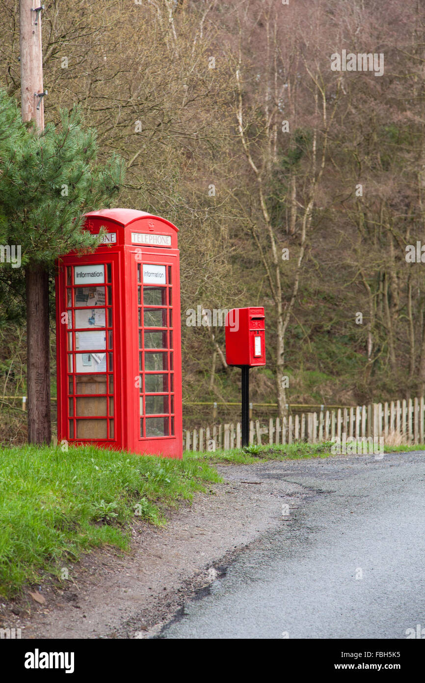Red telephone box and red post box with finger post road sign Stock ...