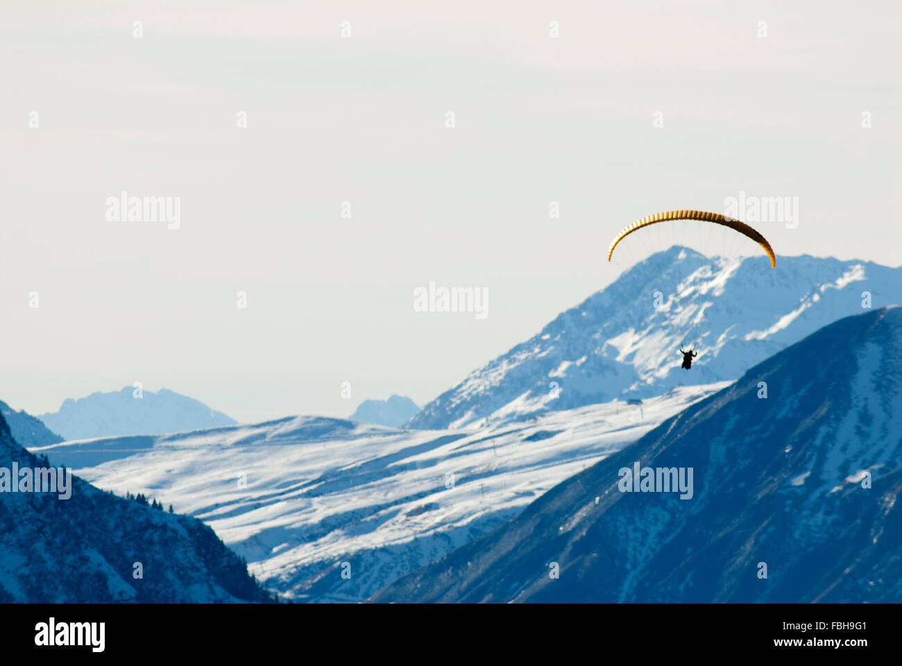 Paraglider pilot soaring high over the Chamonix valley Stock Photo - Alamy