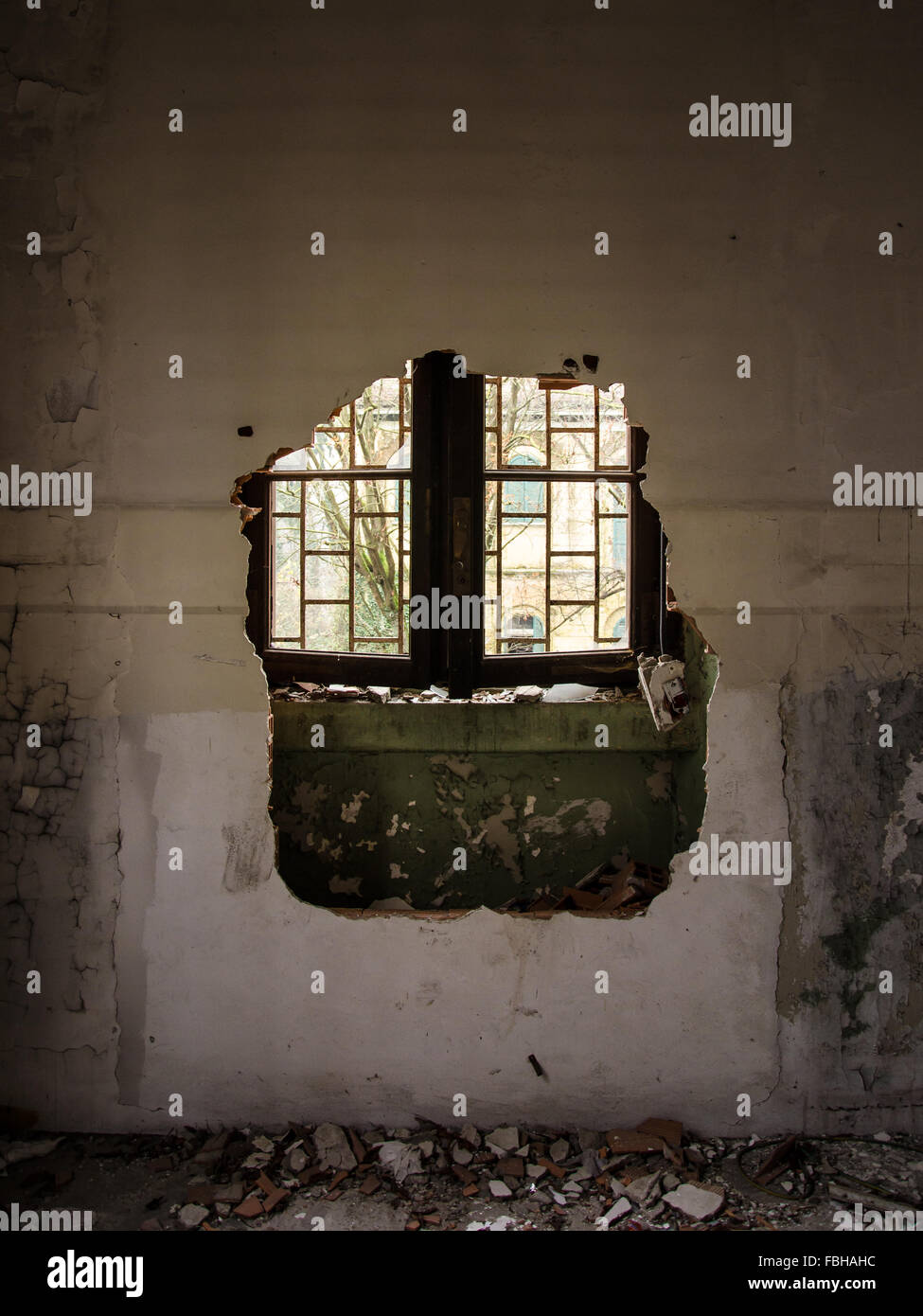 aperture in a wall, interior of an abandoned asylum Stock Photo - Alamy