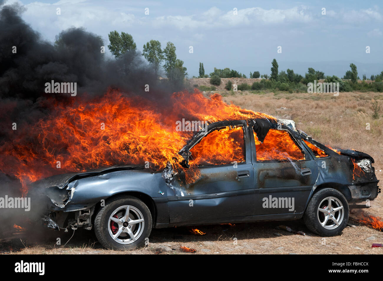 A car burning near the city of Gori during the Russo-Georgian War ...