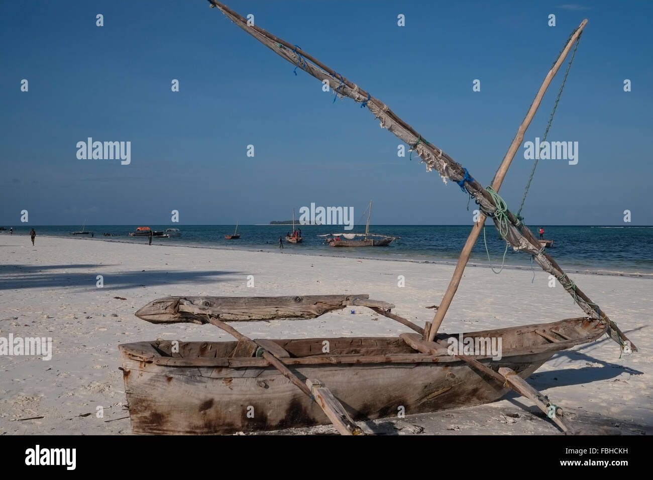 A Ngalawa or Ungalawa traditional, double-outrigger canoe used as a ...