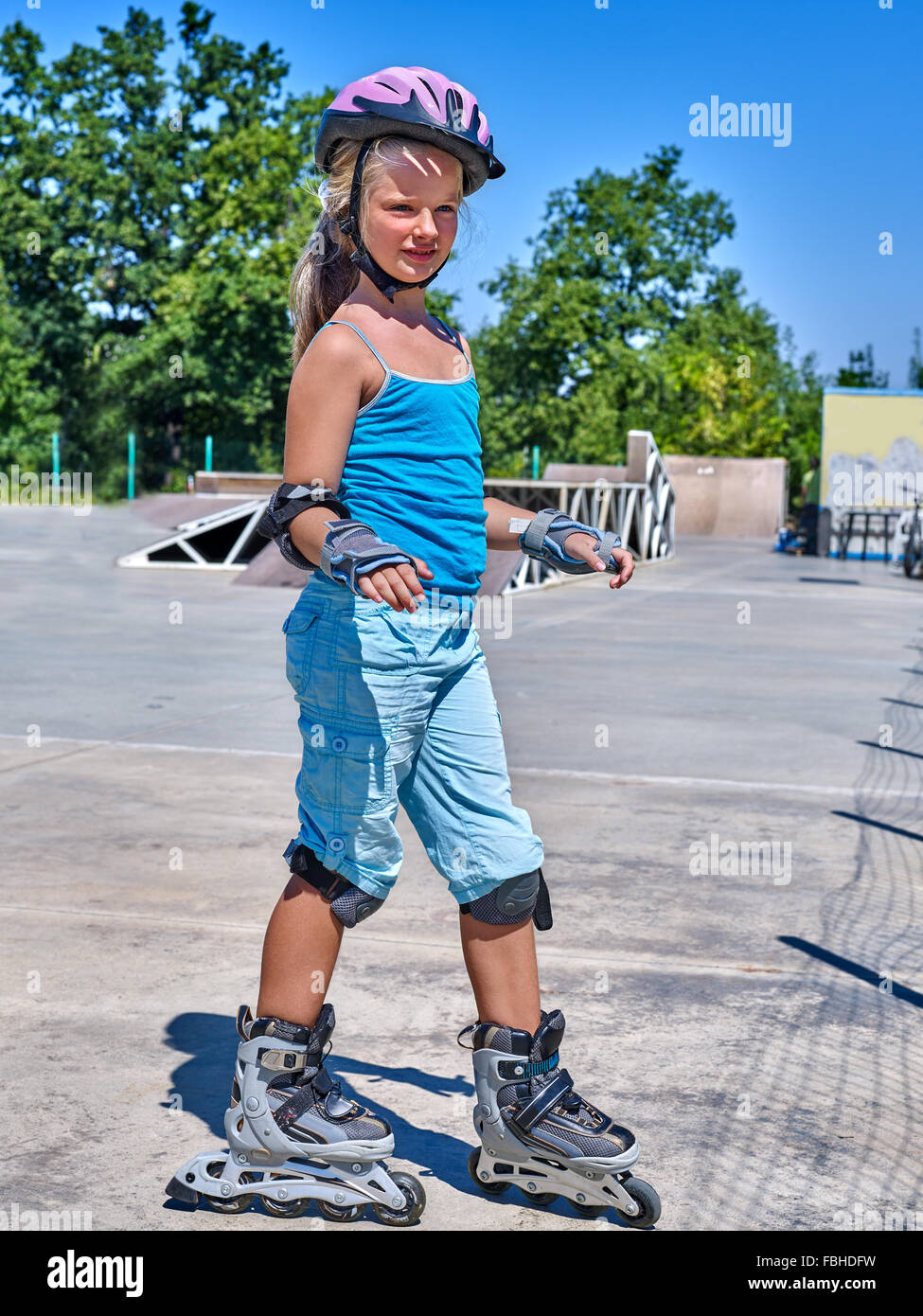 Girl riding on roller skates Stock Photo - Alamy