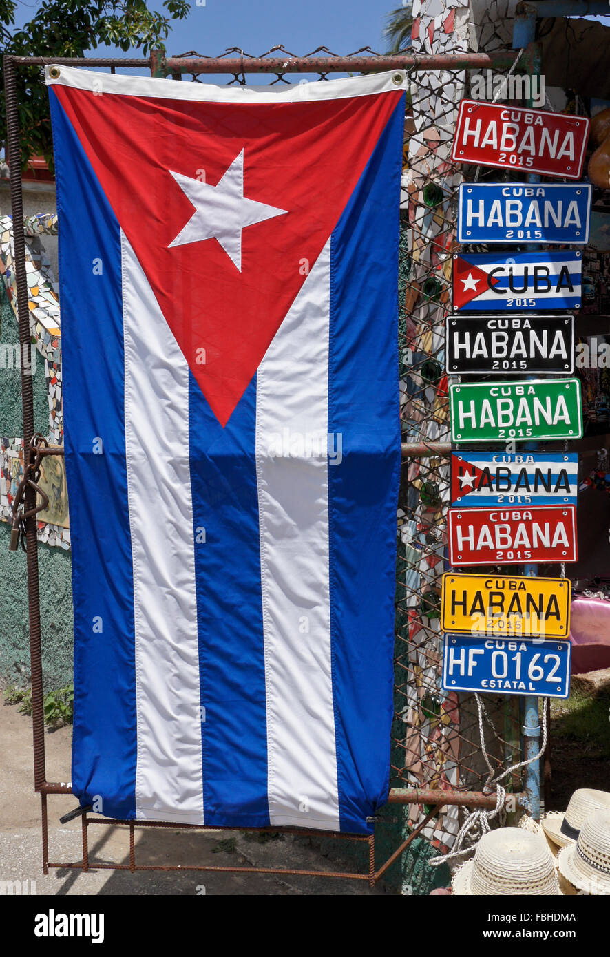 Cuban flag and souvenir license plates for sale at tourist shop, Havana ...