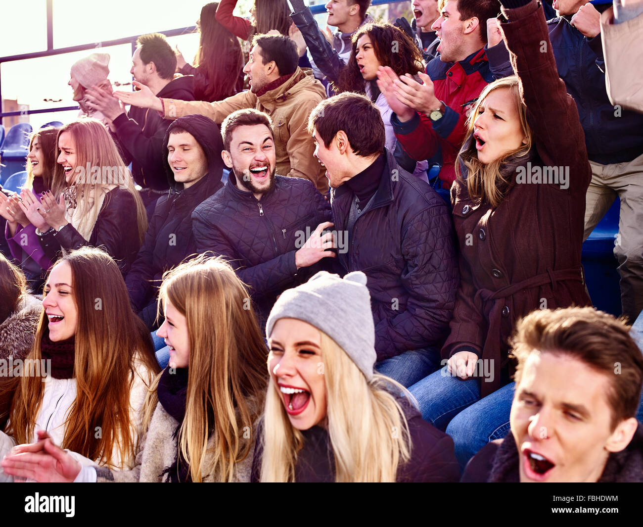 Sport fans clapping and singing on tribunes Stock Photo - Alamy