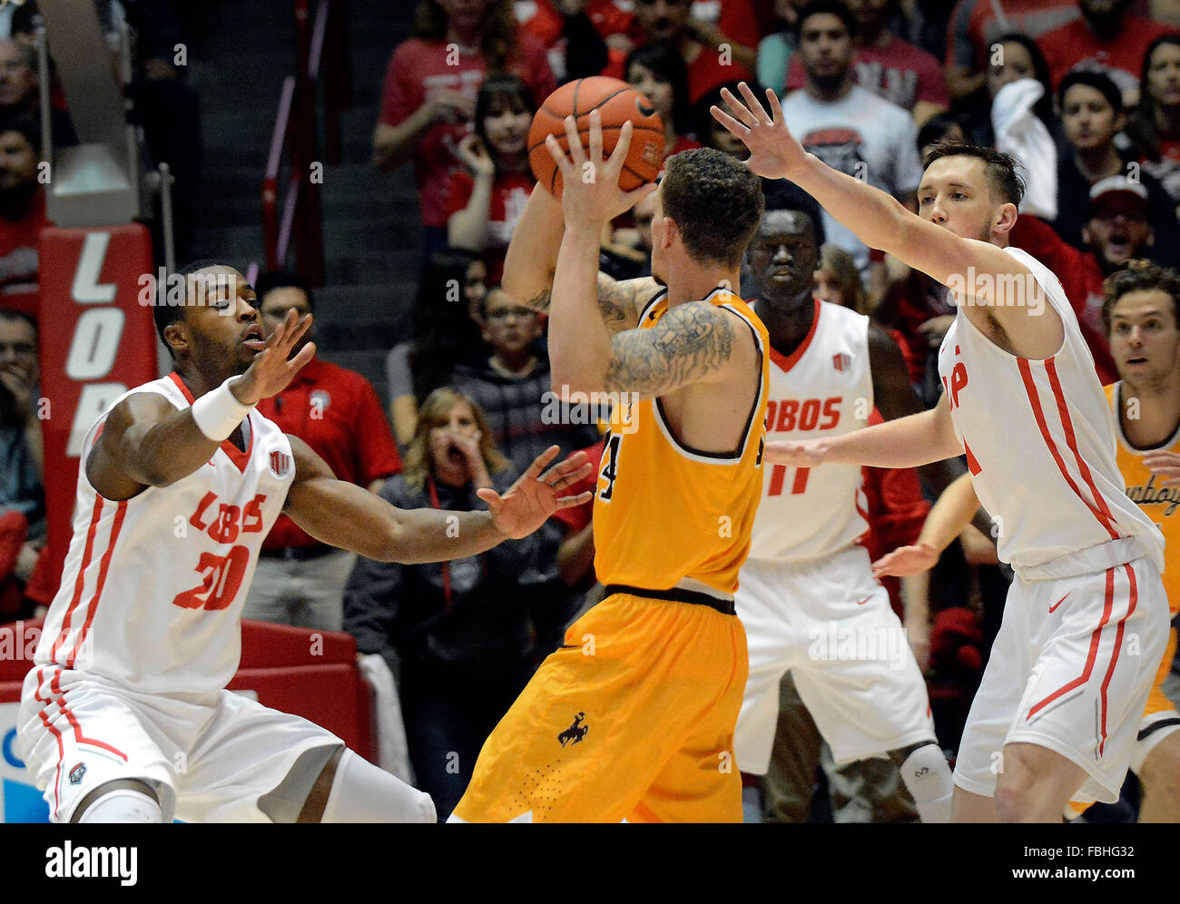 Albuquerque, NM, USA. 16th Jan, 2016. Wyoming's #14 Josh Adams is ...