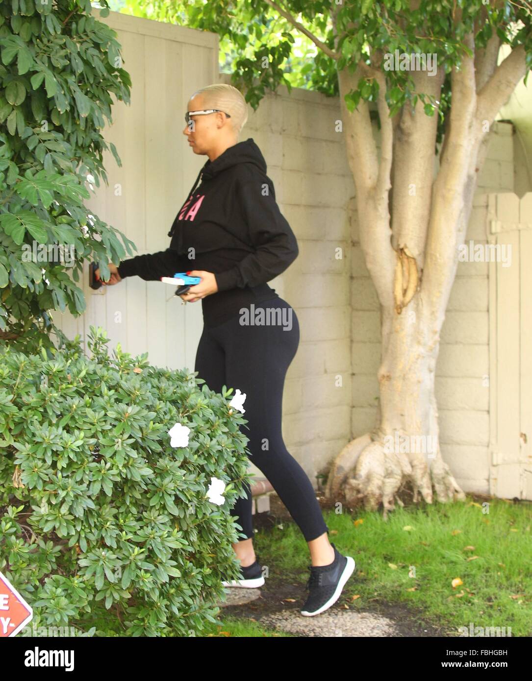 Amber Rose dressed in a FVCKA jogging suit, takes her son to the park ...