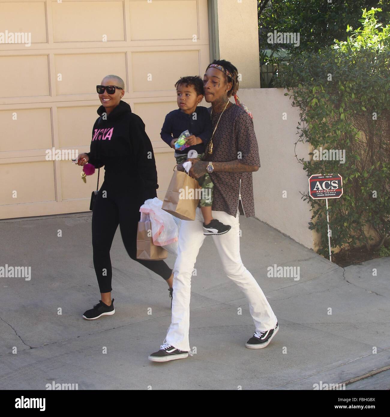 Amber Rose dressed in a FVCKA jogging suit, takes her son to the park ...