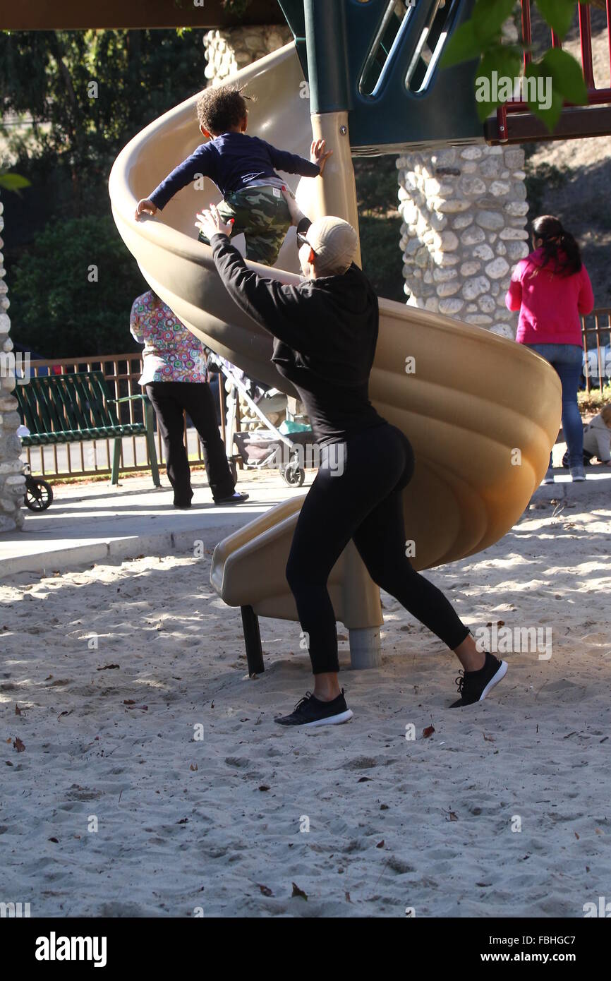 Amber Rose dressed in a FVCKA jogging suit, takes her son to the park ...