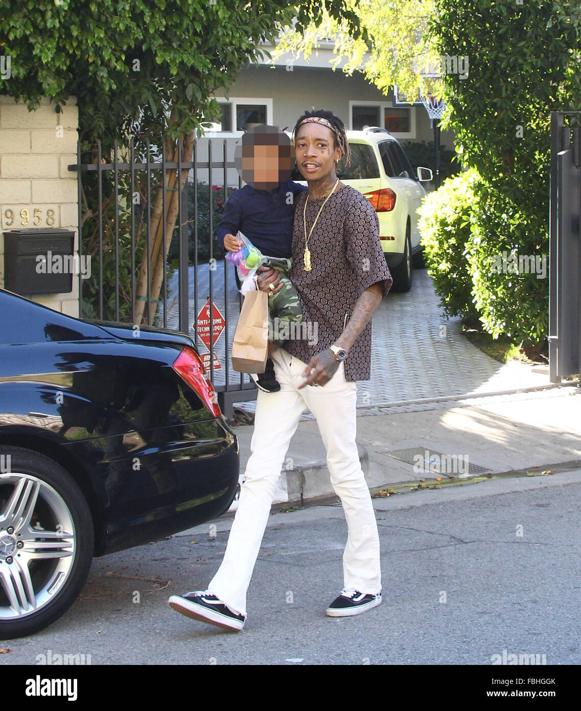 Amber Rose dressed in a FVCKA jogging suit, takes her son to the park ...