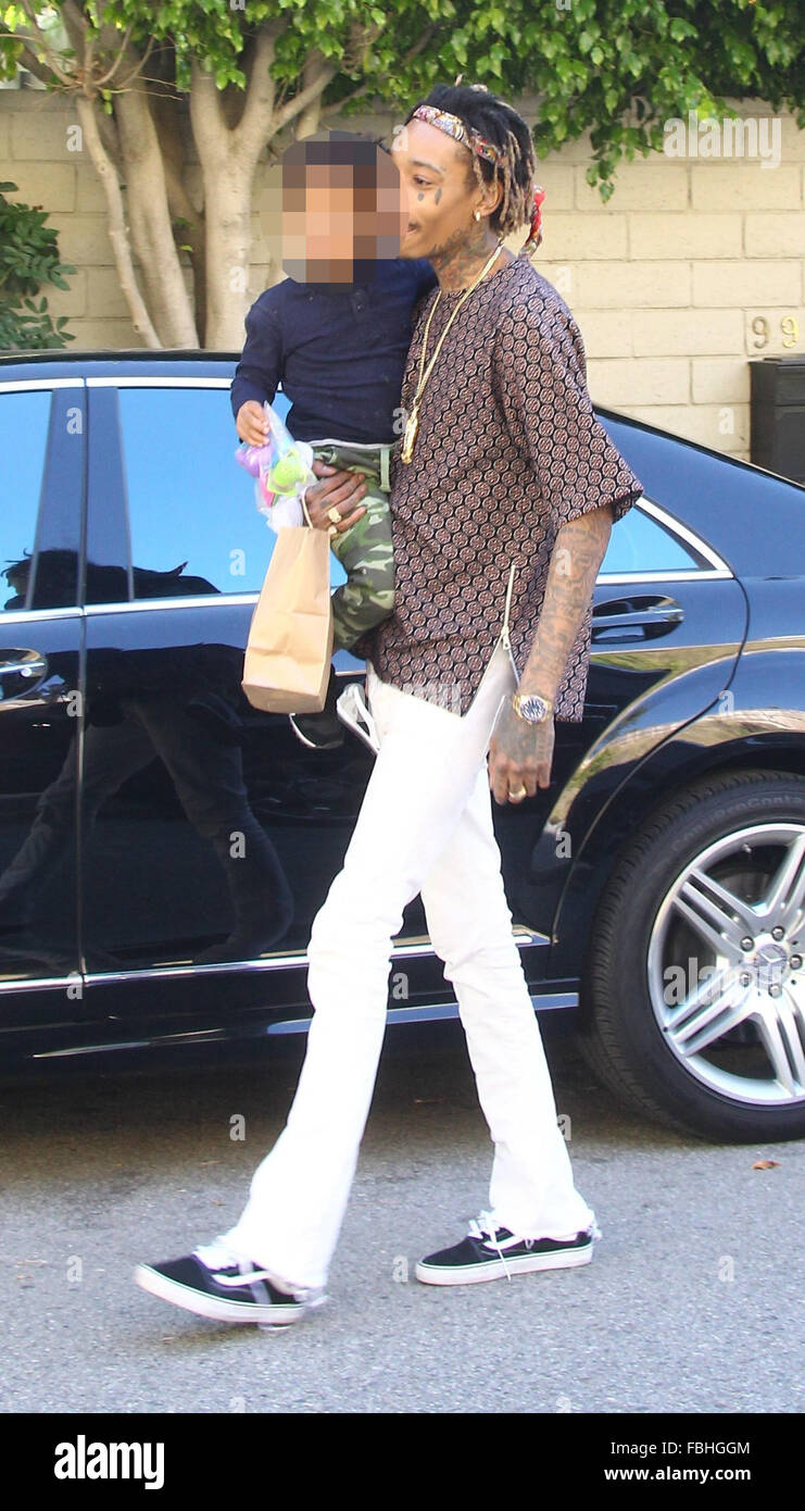 Amber Rose dressed in a FVCKA jogging suit, takes her son to the park ...