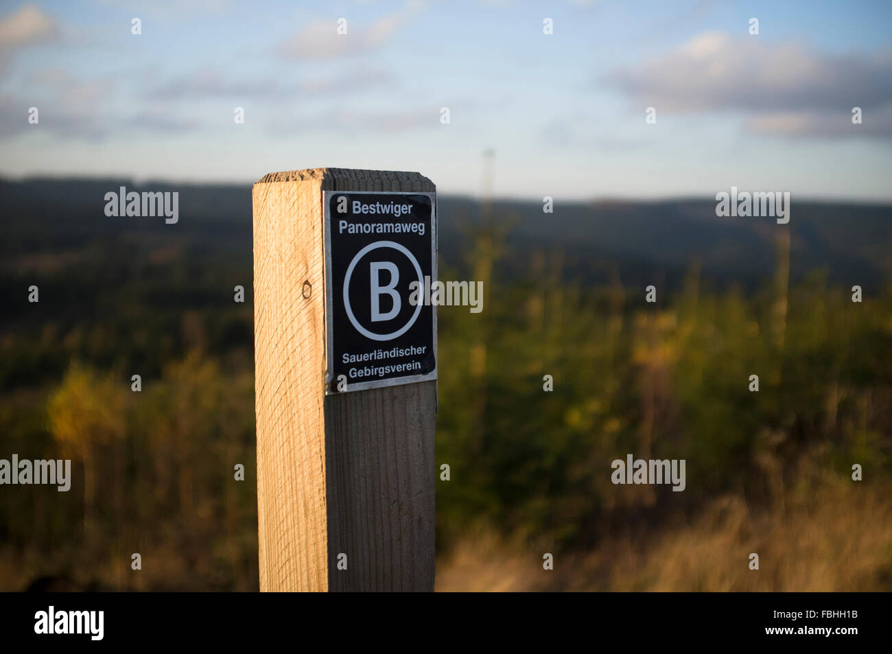 Hiking sign at wooden stake with panorama in the background Stock Photo ...