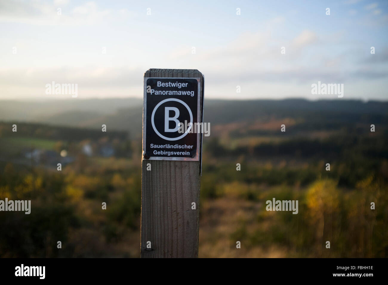 Hiking sign at wooden stake with panorama in the background Stock Photo ...