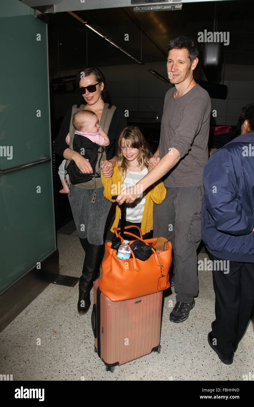 Milla Jovovich and family arrive on a flight to Los Angeles ...