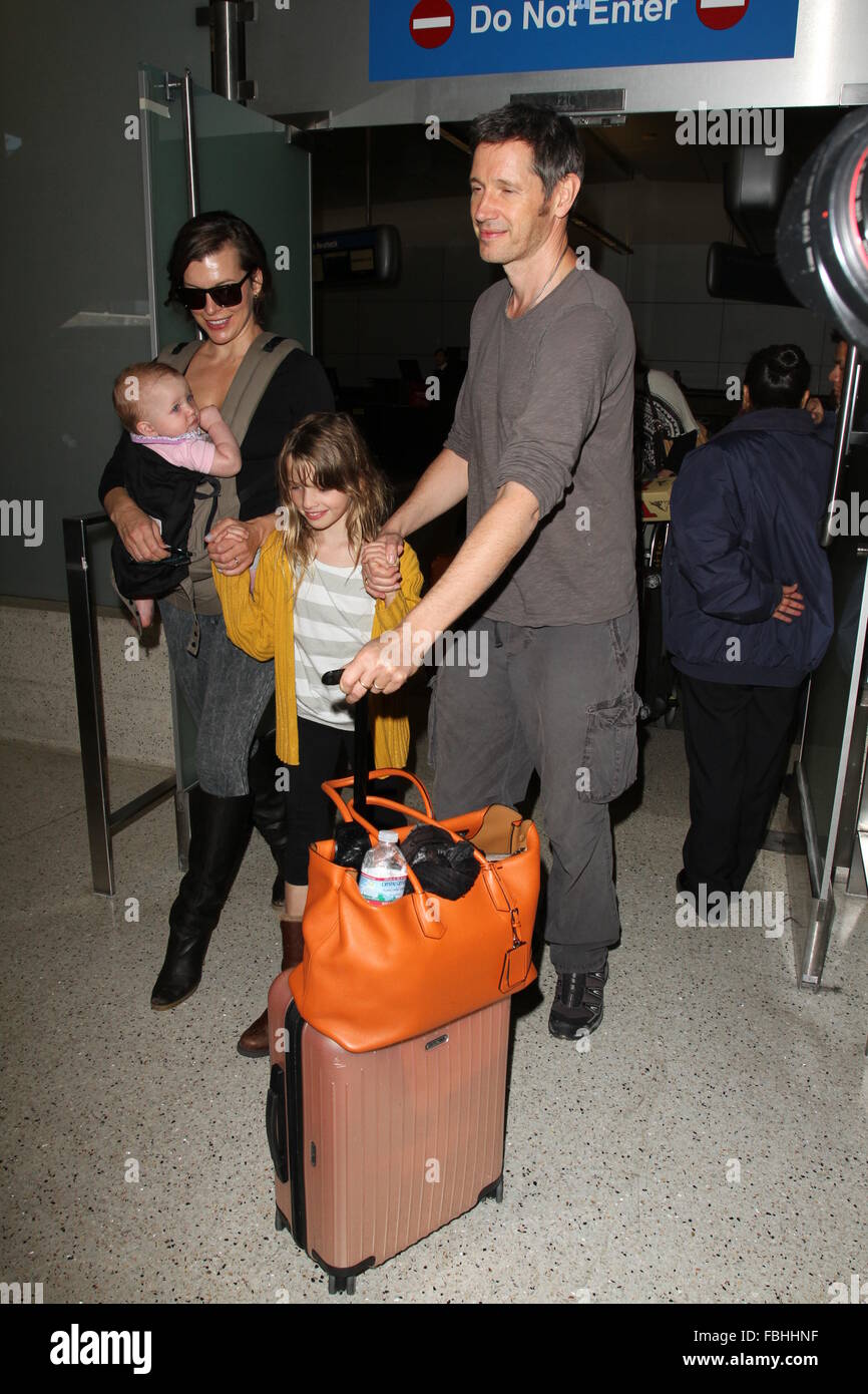 Milla Jovovich and family arrive on a flight to Los Angeles ...
