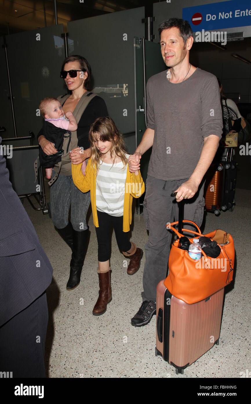 Milla Jovovich and family arrive on a flight to Los Angeles ...