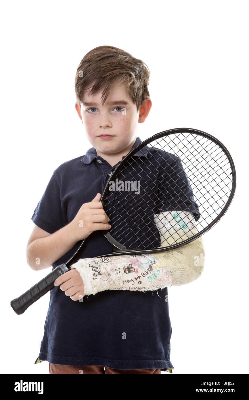 Close up upper body shot of a cute young boy who has broken his left ...