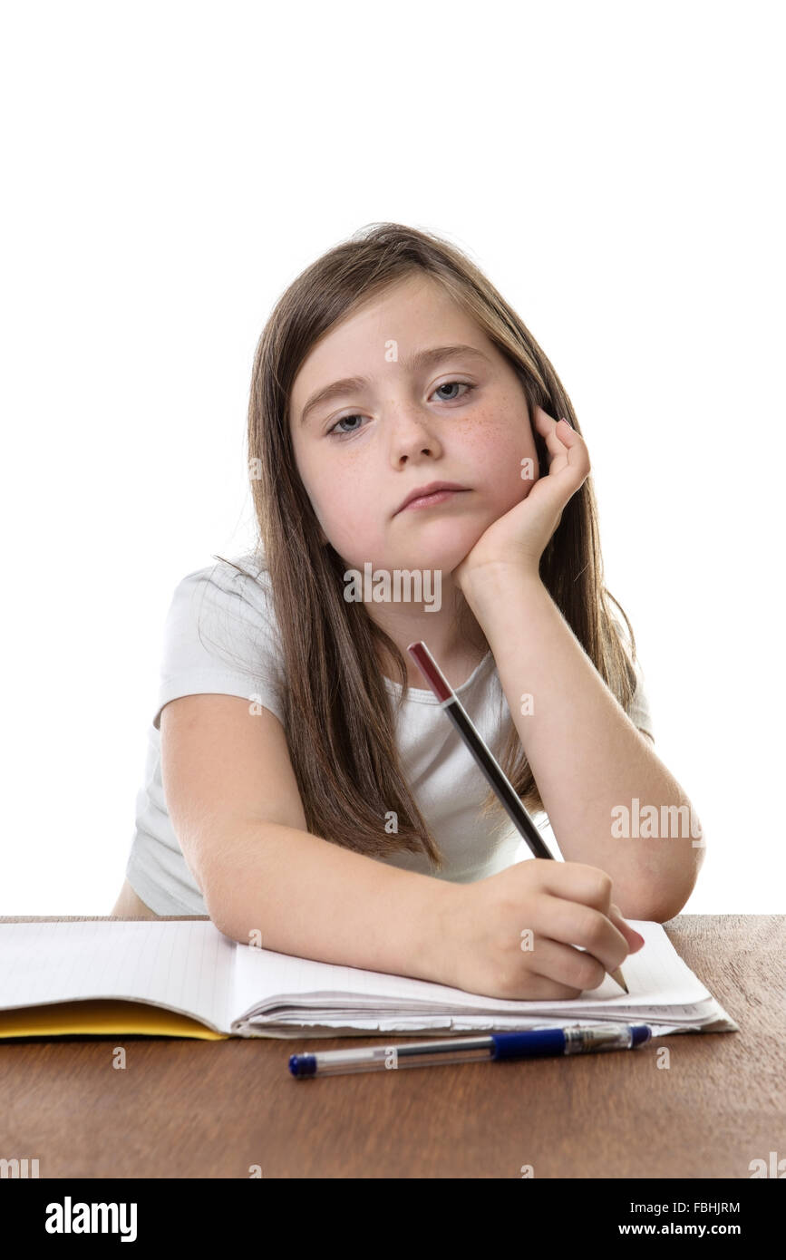Studious young girl is trying hard with her homework Stock Photo - Alamy