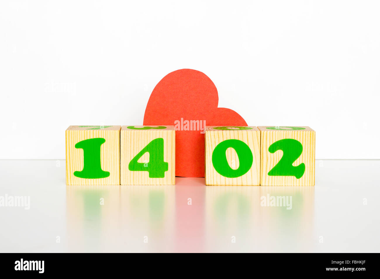 Wood cube with inscription 14 february and red hearts shape Stock Photo ...