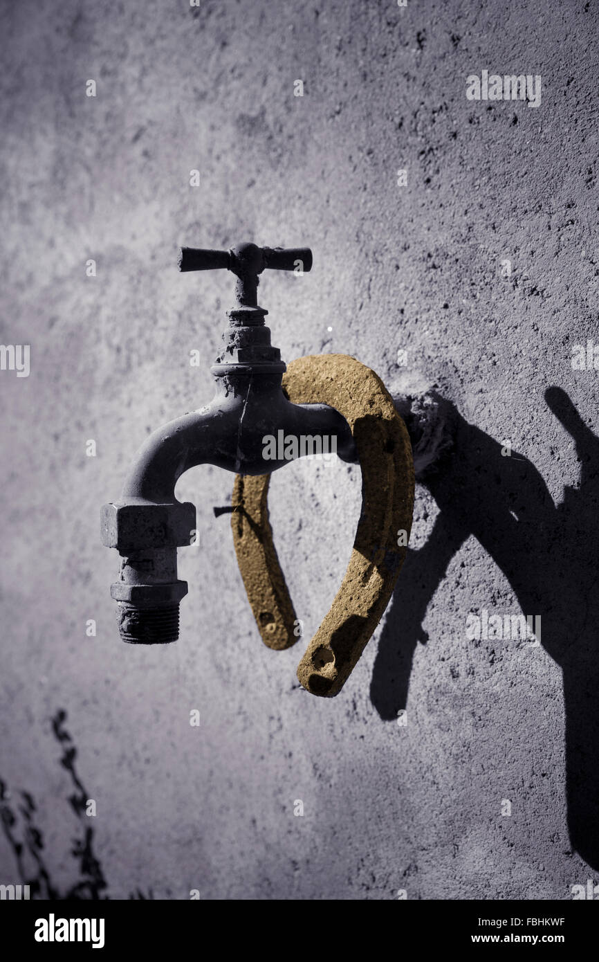 Horseshoe over tap Stock Photo - Alamy