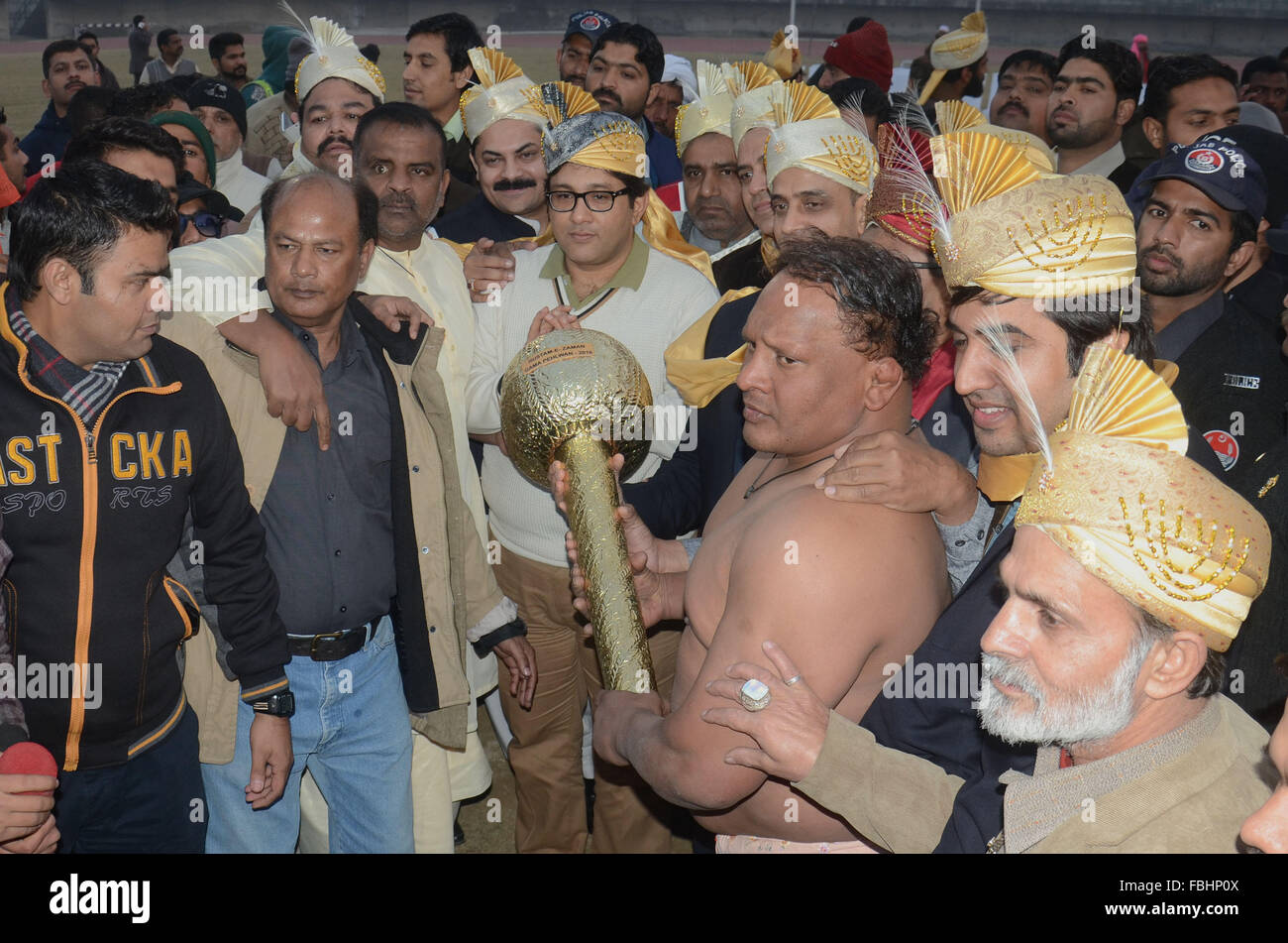 Lahore, Pakistan. 16th Jan, 2016. A wrestler champion holding his award ...