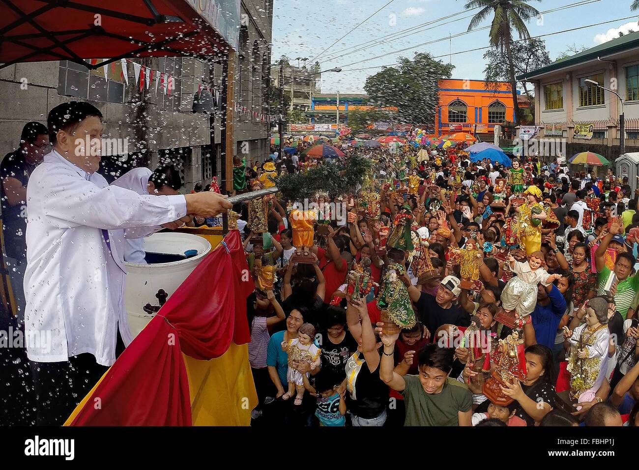 Manila, Philippines. 17th Jan, 2016. People hold statues of the Santo ...
