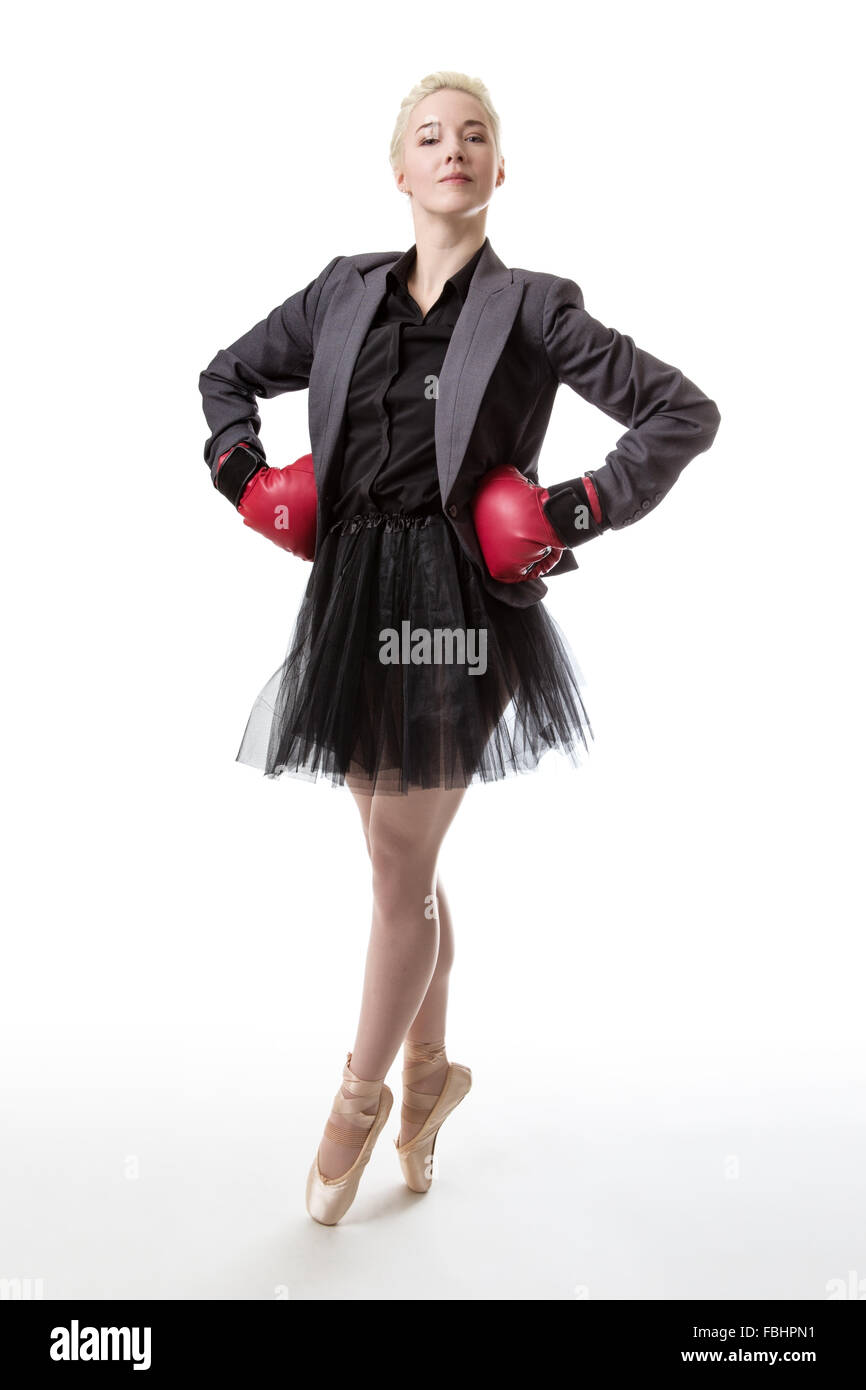 Woman in a business suit and a tutu, wearing boxing gloves Stock Photo ...