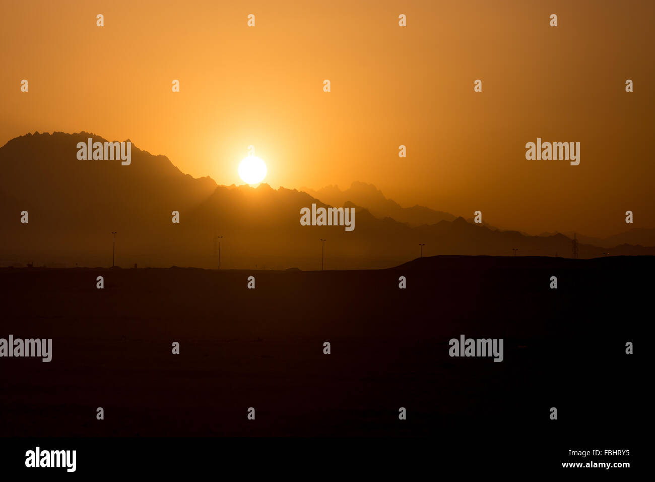 Sun rising or setting in mountains, beautiful mountainous landscape ...