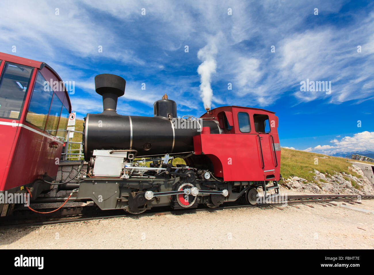 The steam train takes tourists on a mountain peak in the Austrian Alps ...