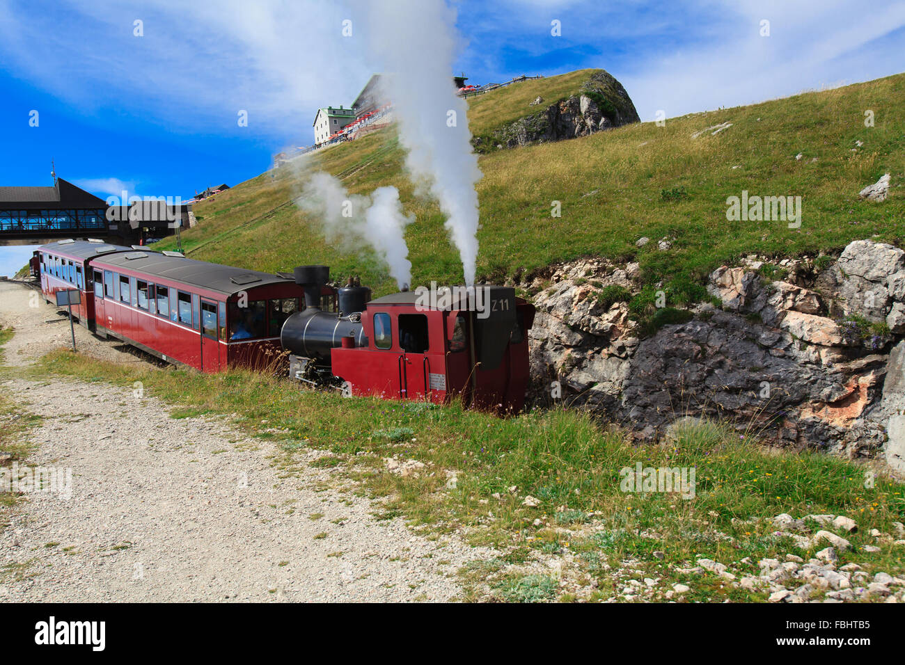 The steam train takes tourists on a mountain peak in the Austrian Alps ...