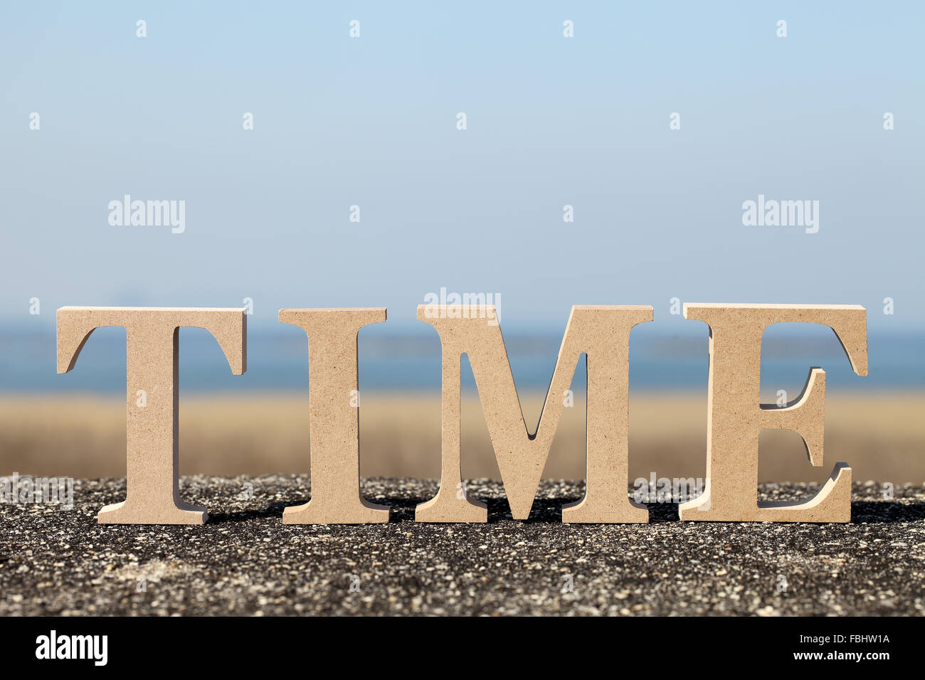 Word time made with wooden block wooden letters Stock Photo - Alamy