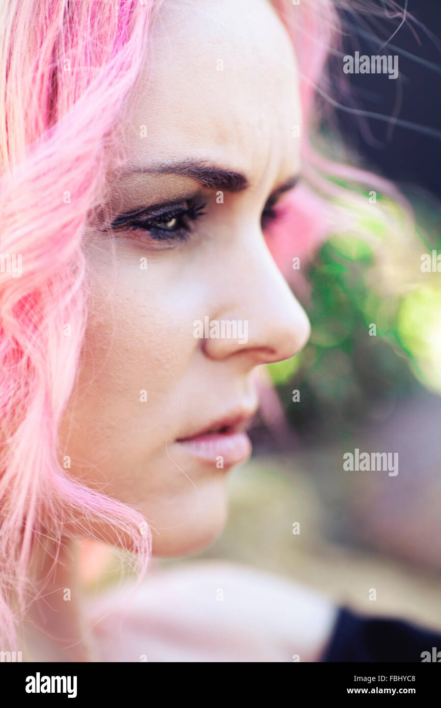 Portrait of a young woman with pink hair, profile Stock Photo - Alamy