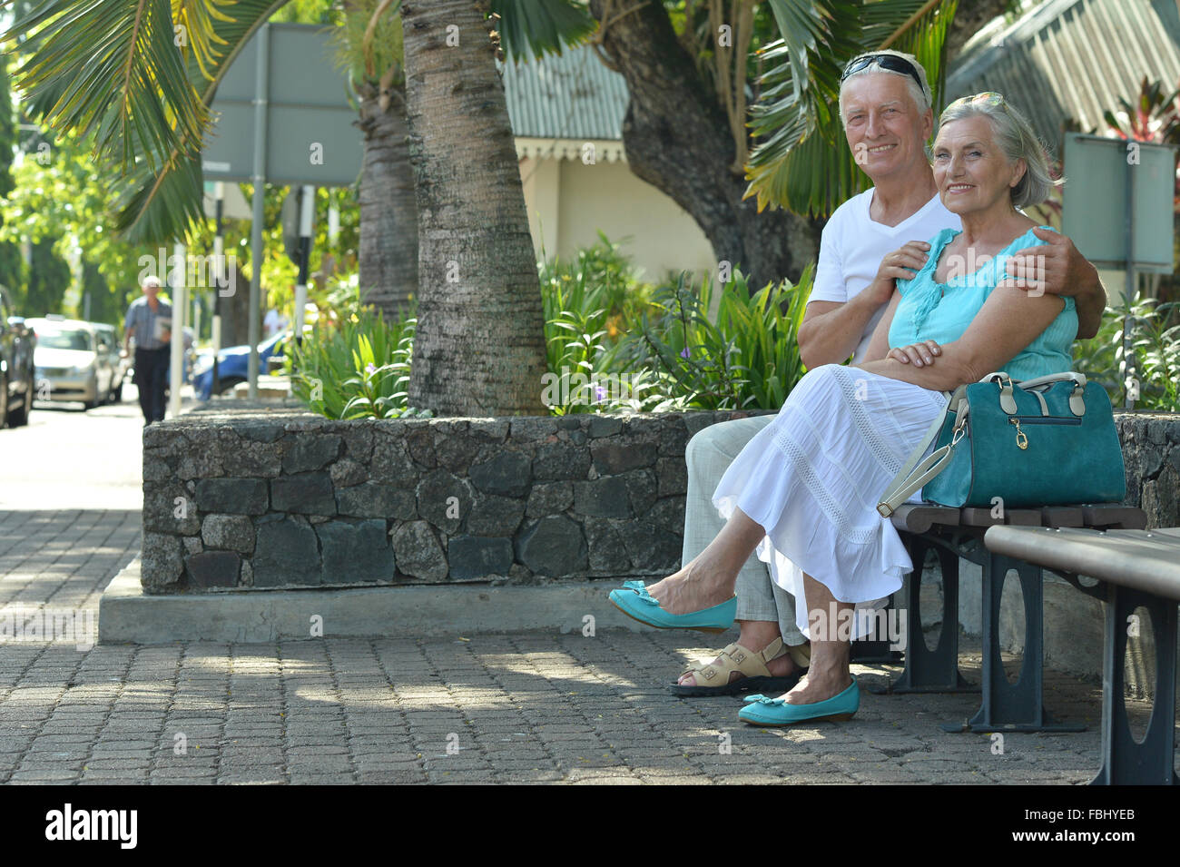 elderly couple rest at tropical resort Stock Photo - Alamy