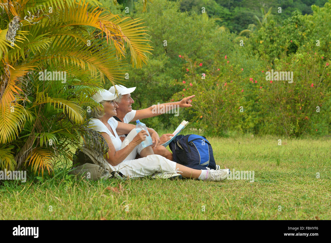 elderly couple rest at tropical resort Stock Photo - Alamy