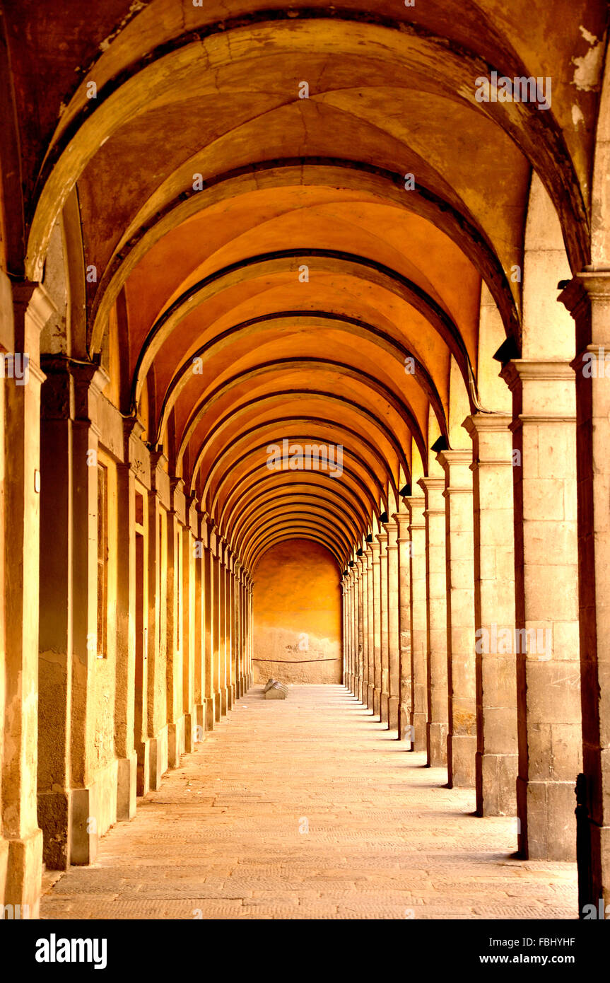 a receding archway in the medieval walled city of Lucca in Tuscany ...