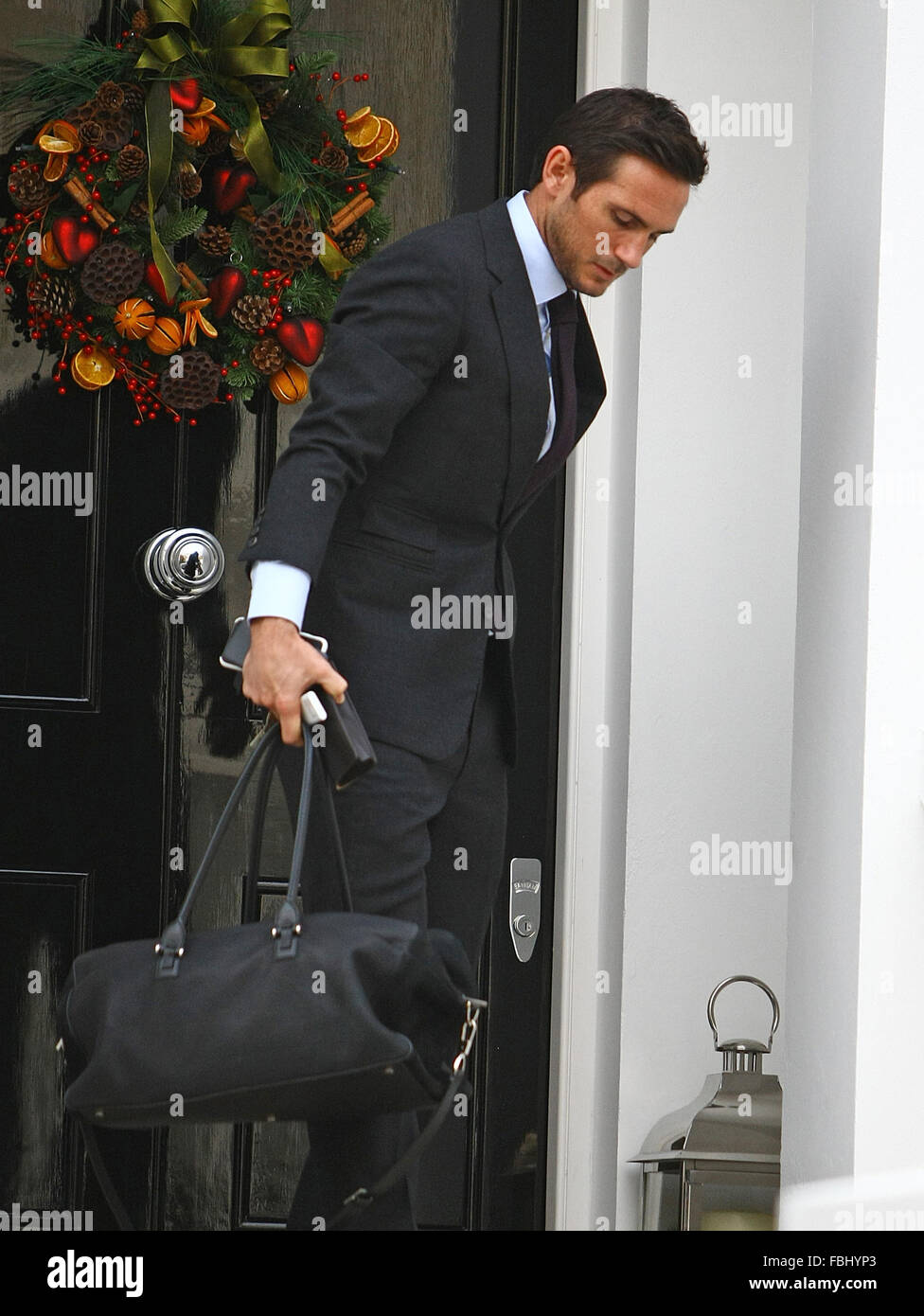 Frank Lampard leaving home, wearing a smart suit and tie. Featuring ...