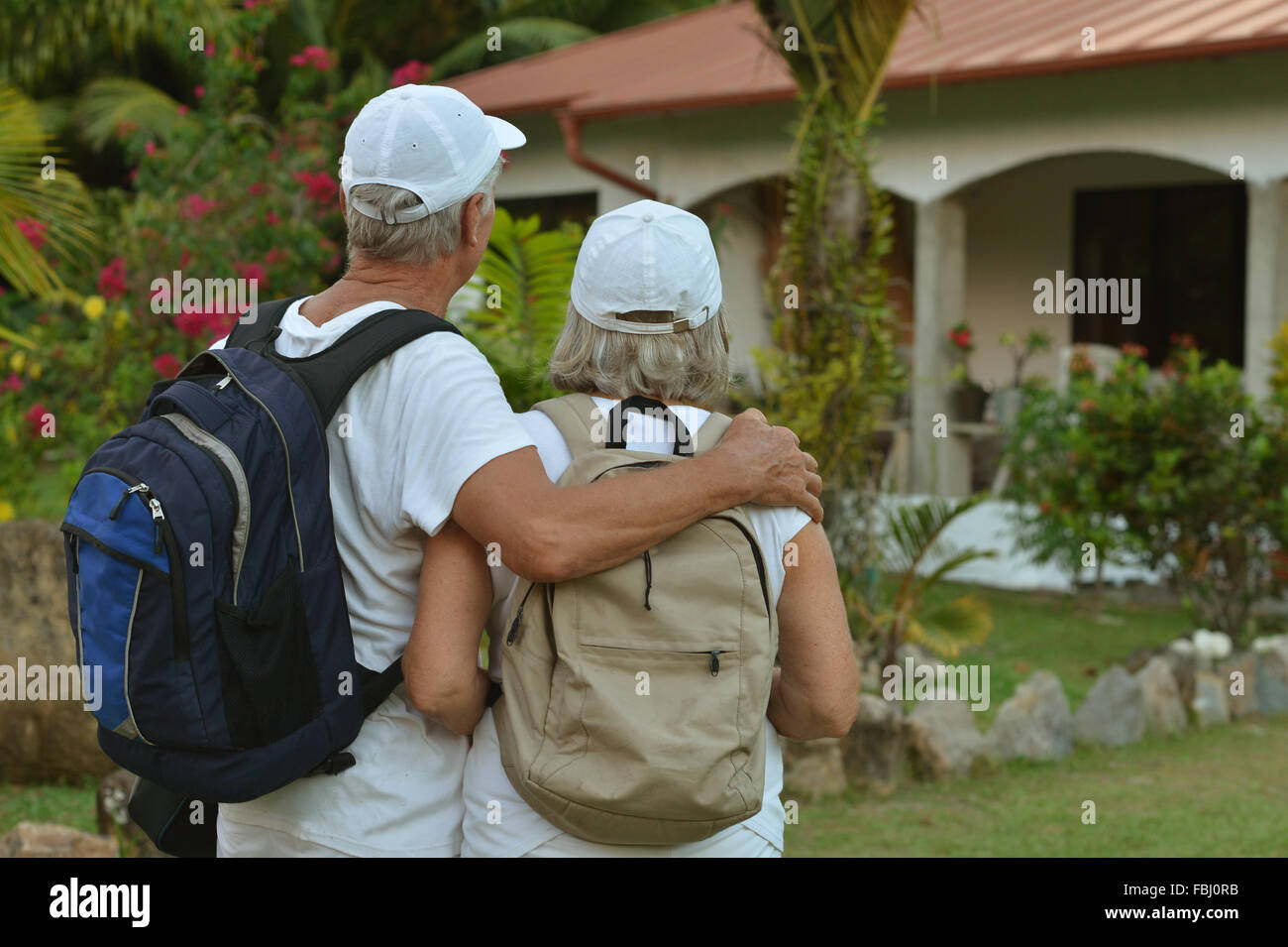 elderly couple rest at tropical resort Stock Photo - Alamy