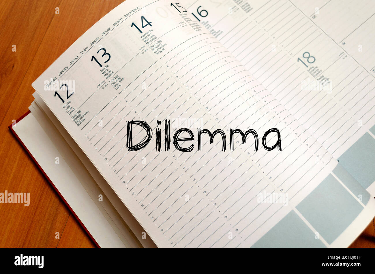 Dilemma text concept write on notebook with pen Stock Photo - Alamy