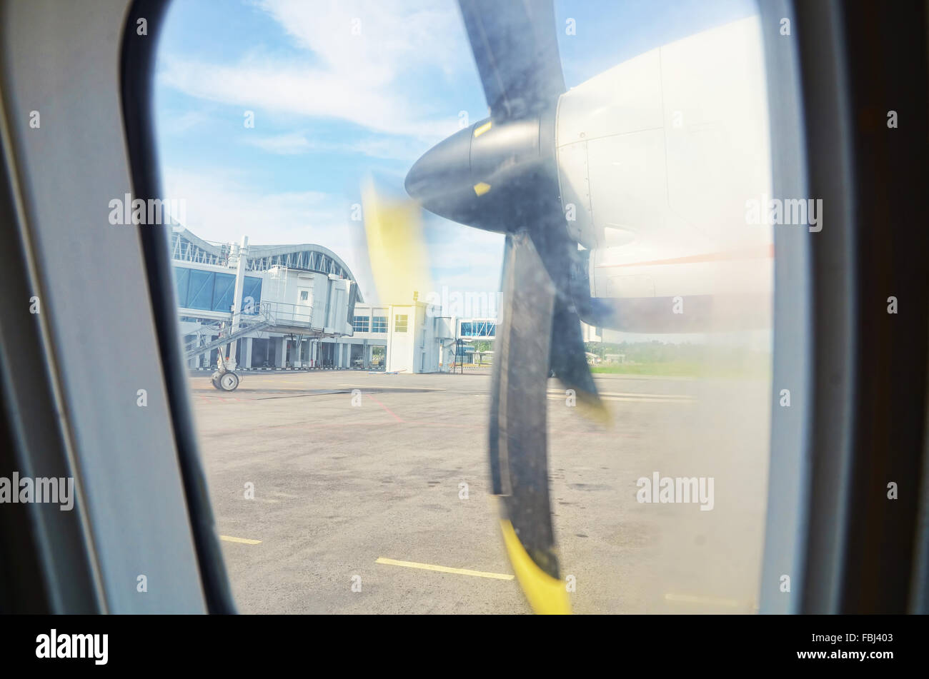 Plane's wing propeller sight from window view Stock Photo - Alamy
