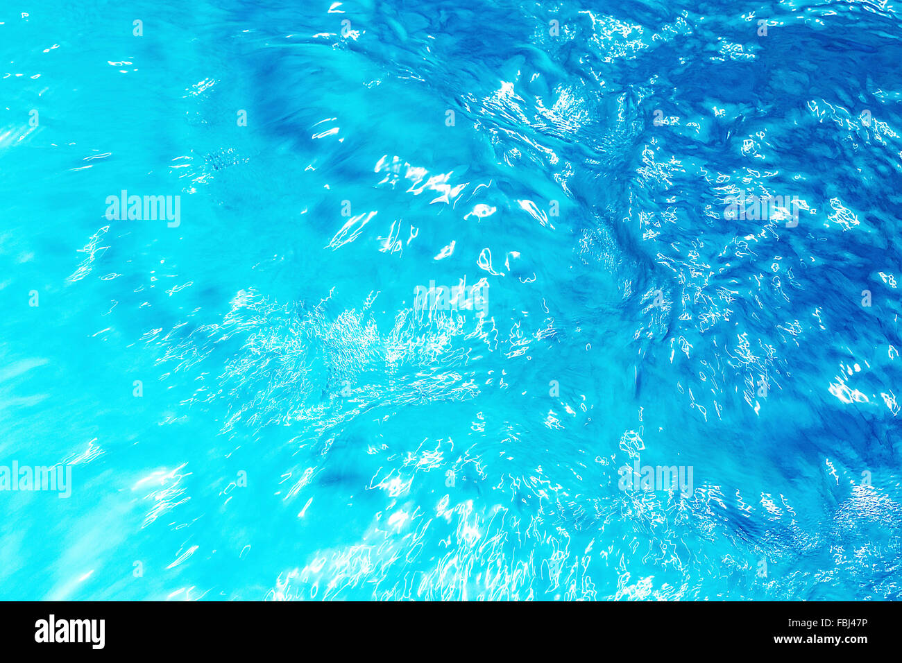 Closeup of blue water waves in the sun Stock Photo - Alamy