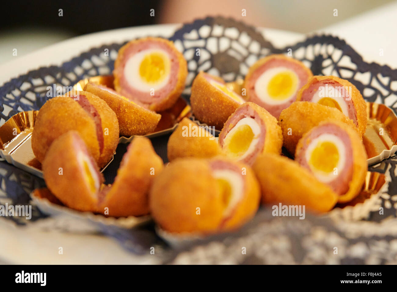 Eggs wrapped in ham Stock Photo - Alamy