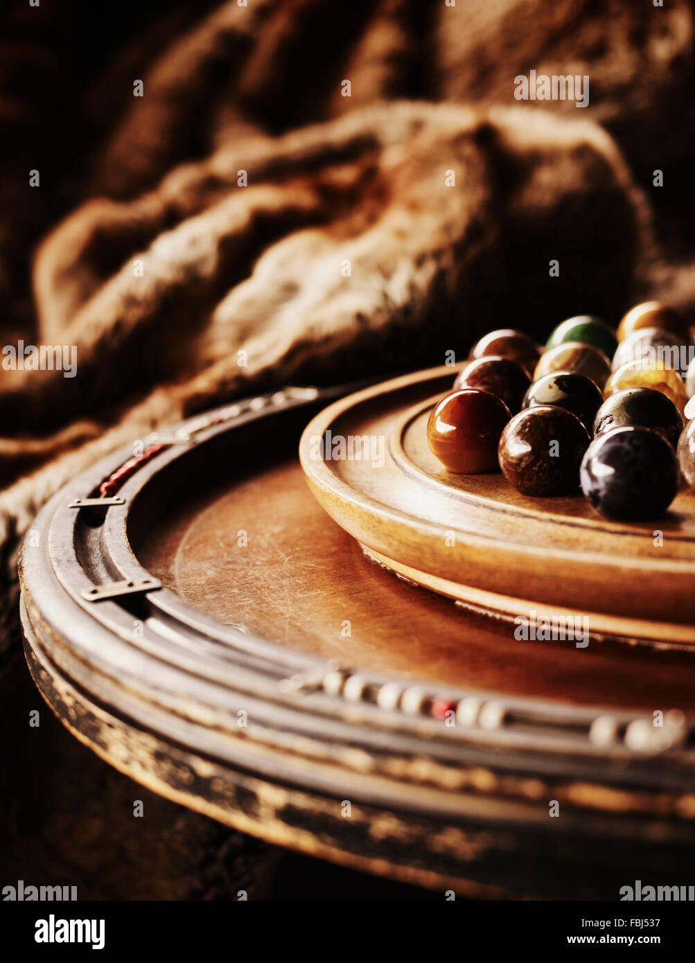 Game, solitaire, wooden table, antique, fur blanket Stock Photo - Alamy